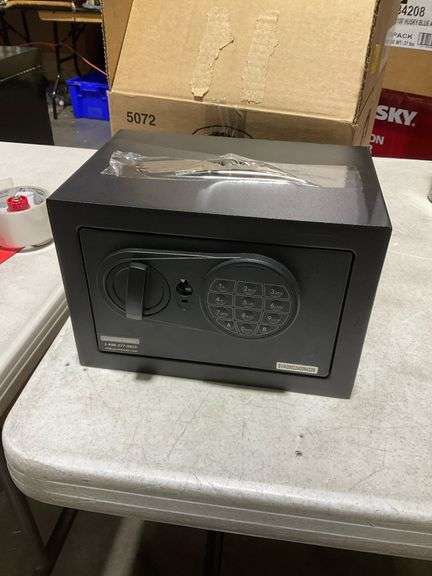 Small safe with keys - Matthews Auctioneers