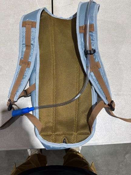 Bass Pro Shop backpack with container - Matthews Auctioneers