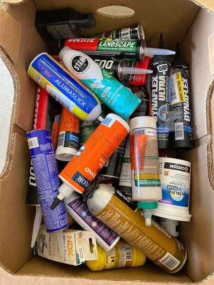 Box Lot of Assorted Adhesives/Caulk - Matthews Auctioneers