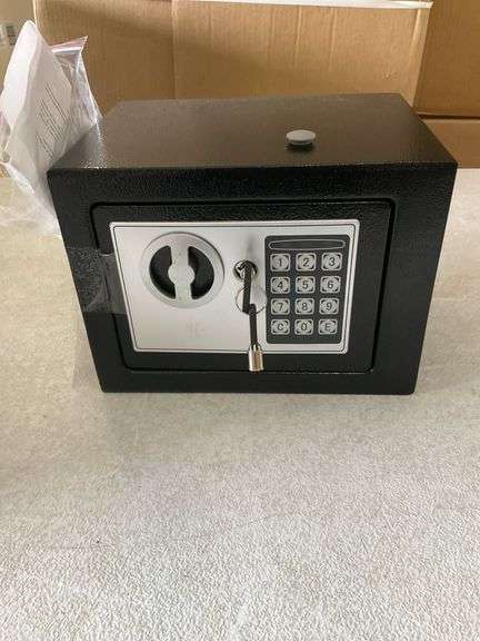 Metal lock box with Key - Matthews Auctioneers