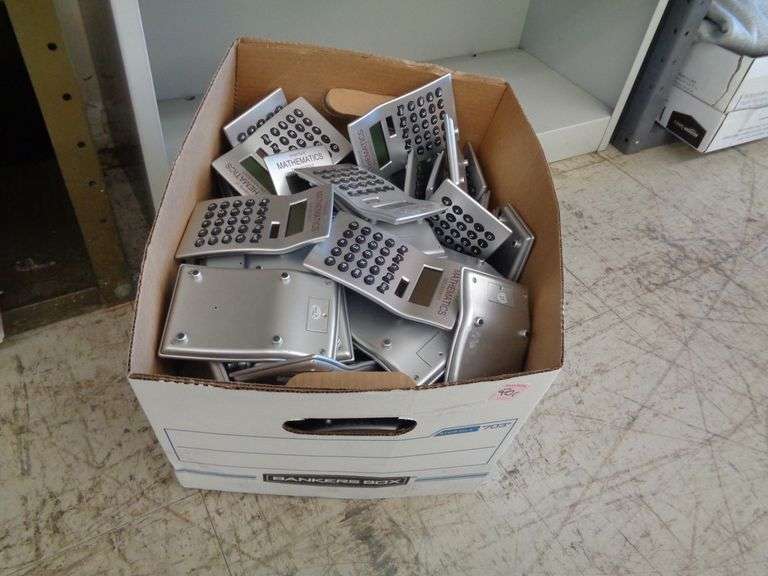 1 EACH-BOX OF CALCULATORS - Matthews Auctioneers