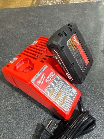 Milwaukee CP2.0 Battery and Charger - Matthews Auctioneers