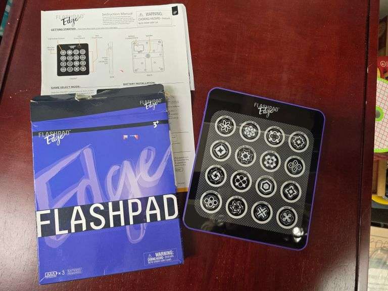 FlashPad Edge Handheld Game w/Light Show & 15 games - Matthews Auctioneers