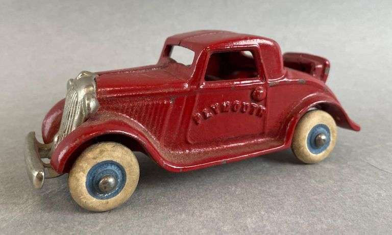 Arcade Plymouth Cast Iron Car - Matthew Bullock Auctioneers