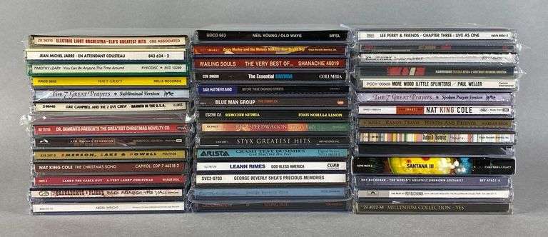 Group of 30+ Iconic Artist CDs and More - Matthew Bullock Auctioneers