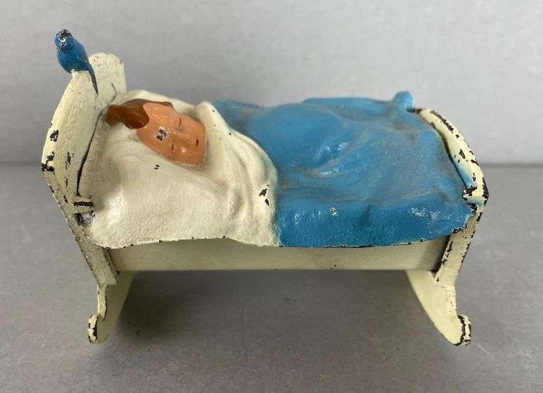 Cast Iron Baby in Cradle Bank - Matthew Bullock Auctioneers