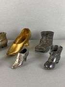 Group of 8 Decorative Metal Shoes - Matthew Bullock Auctioneers