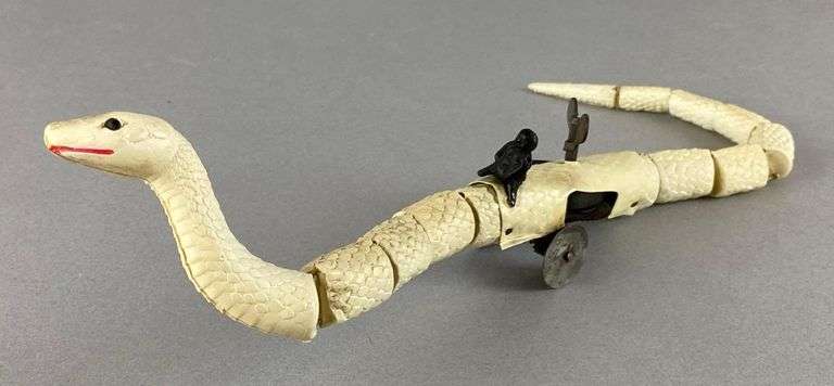 Vintage Celluloid Man on Snake Wind-Up Toy - Matthew Bullock Auctioneers