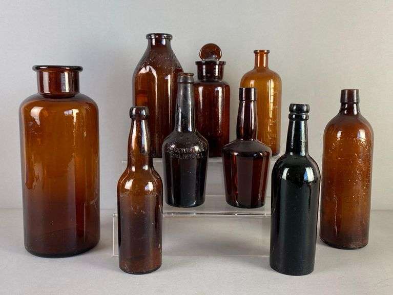 Group of 9 Vintage Brown Glass Bottles - Matthew Bullock Auctioneers
