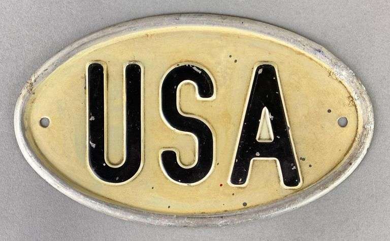 1960’s USA International Oval License Plate - Matthew Bullock Auctioneers