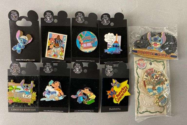 Group of 9 Disney Stitch Enamel Pins and More - Matthew Bullock Auctioneers