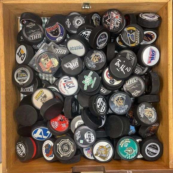 Group of NHL and AHL Hockey Pucks - Matthew Bullock Auctioneers