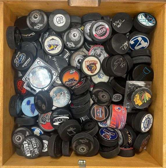 Group of NHL and AHL Hockey Pucks - Matthew Bullock Auctioneers