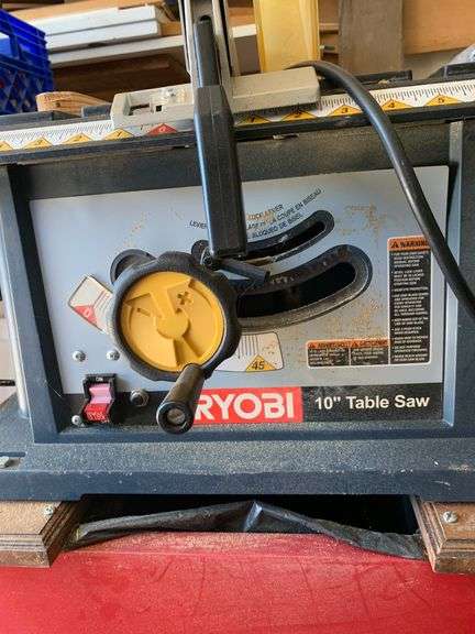 Ryobi 10" table saw on work stand - McNatt Real Estate