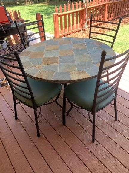 Tile top patio table and 4 chairs - McNatt Real Estate