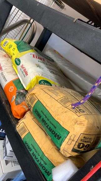 2 bags motar mix -2 bags Turf builder - McNatt Real Estate