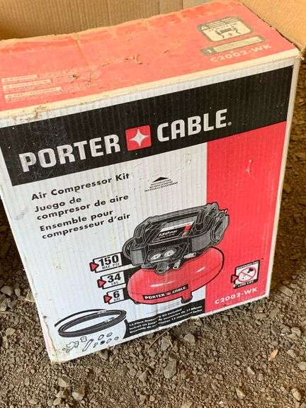 Porter Cable Air compressor in box - McNatt Real Estate