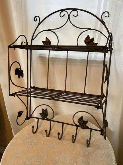 Heavy wrought iron shelf with bottom row of hangers - McNatt Real Estate