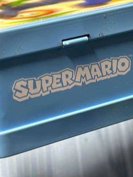 Mario metal box with lots of Pokémon cards - McNatt Real Estate