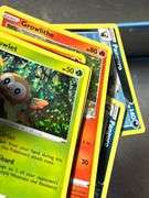 Mario metal box with lots of Pokémon cards - McNatt Real Estate