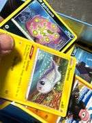 Mario metal box with lots of Pokémon cards - McNatt Real Estate
