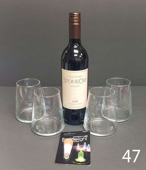StoneCap Merlot, 2018 with four stemless glasses and bottle light ...