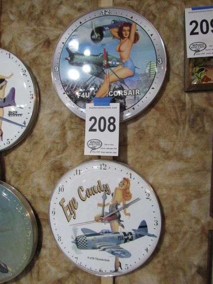 TWO PIN UP GIRL BATTERY CLOCKS - 14" - McPherson Auction & Realty