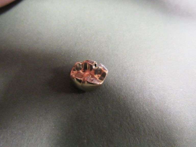 GOLD MOLAR TOOTH CAP - McPherson Auction & Realty