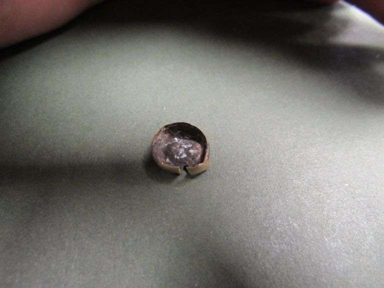GOLD MOLAR TOOTH CAP - McPherson Auction & Realty