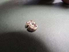 GOLD MOLAR TOOTH CAP - McPherson Auction & Realty