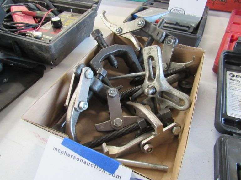 BOX OF PULLERS AND PULLER PARTS - McPherson Auction & Realty
