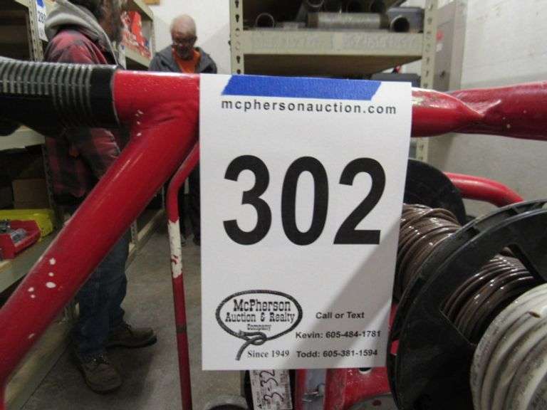 UPRIGHT WIRE CART WITH 12 SPOOLS OF WIRE - McPherson Auction & Realty