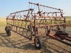 35' IH MOD. 354 FOLDING SPRING TOOTH HARROW - McPherson Auction & Realty