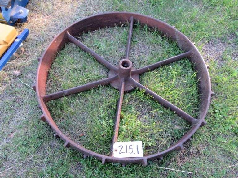 33" ROUND STEEL WHEEL LAWN DECORATION - McPherson Auction & Realty