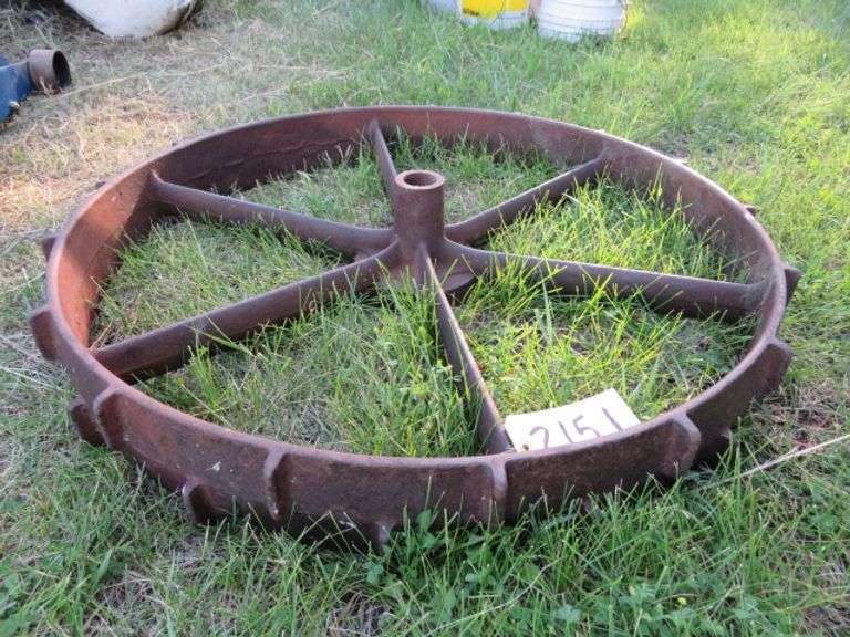 33" ROUND STEEL WHEEL LAWN DECORATION - McPherson Auction & Realty