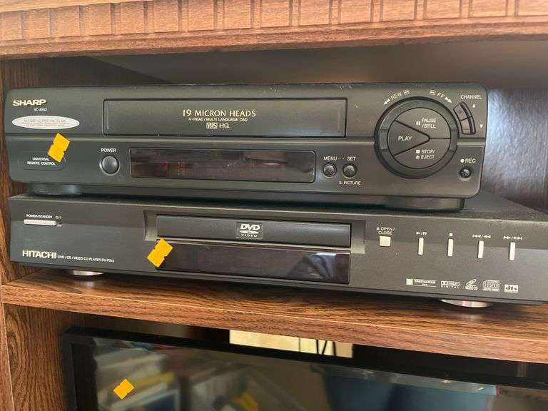 Sharp vhs, hitachi dvd/cd player - Metzger Property Services, LLC