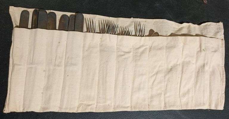 Silver plate utensils in rag carrier - Metzger Property Services, LLC