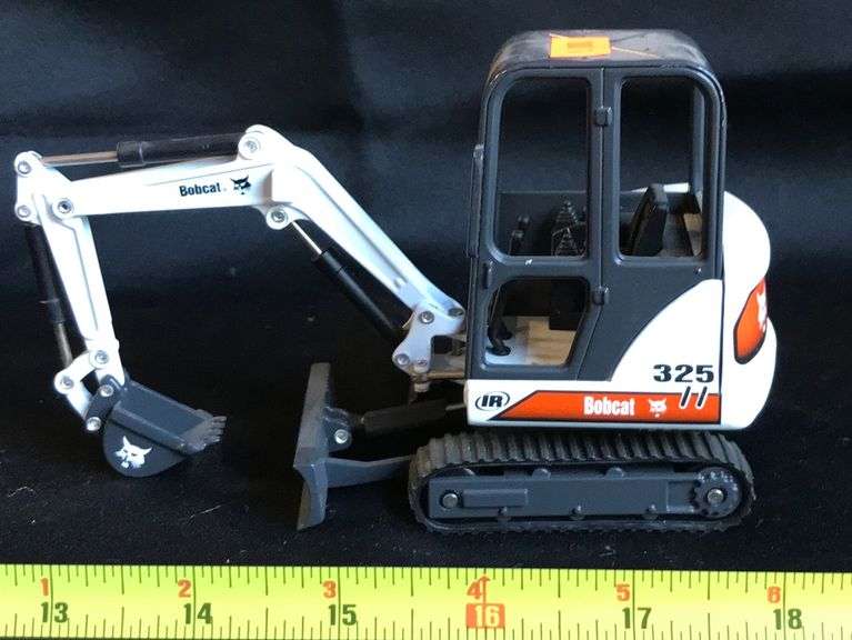 IR Bobcat Excavator metal - Metzger Property Services, LLC