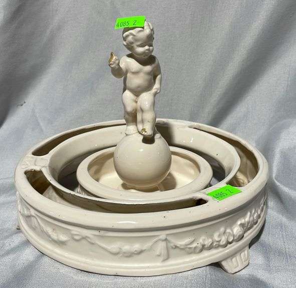 Ceramic fountain model planter - Metzger Property Services, LLC