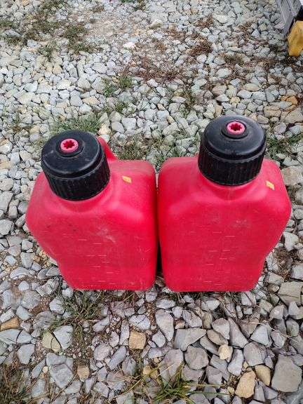 2- 5 gallon gas cans - Metzger Property Services, LLC