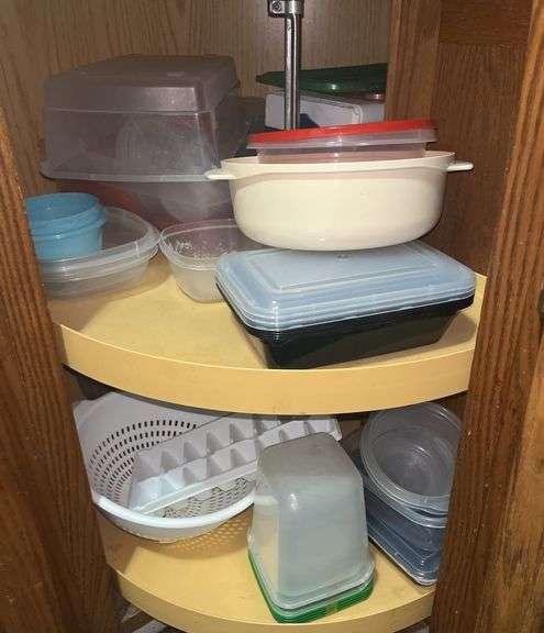 Plastic containers, misc. contents of cabinet as shown in pictures ...