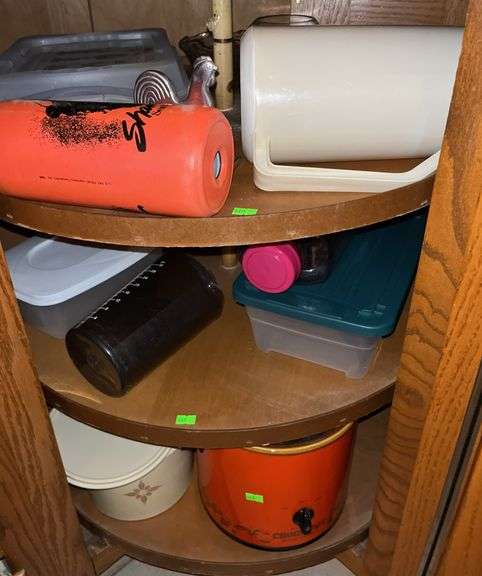 Crock pot, plastic containers, misc contents of corner cabinet as shown ...