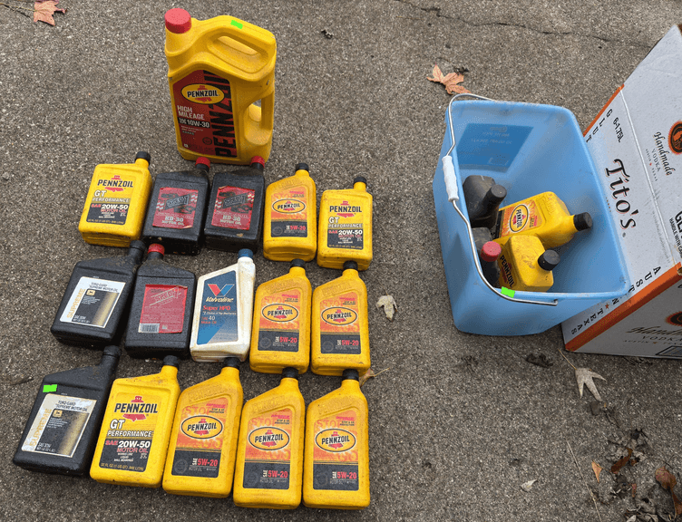 Motor oil assortment 16 full & 4 partials - Metzger Property Services, LLC