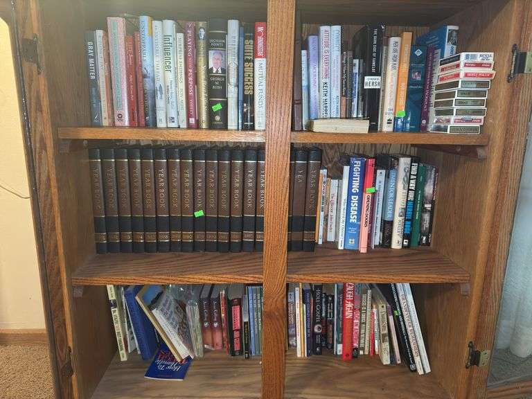 Book assortment including Encyclopedia yearbooks, playing cards ...