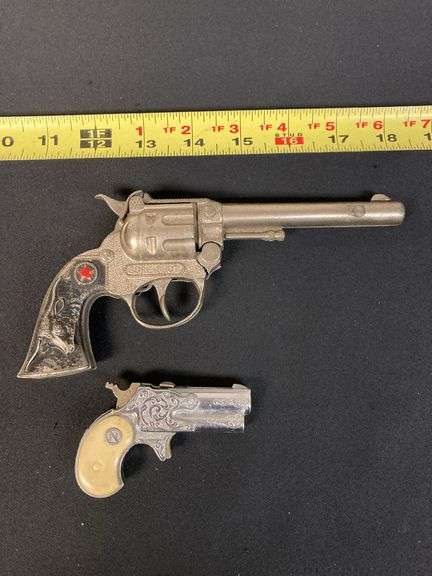 2-Sureshot Metal Cap Guns - Metzger Property Services, LLC