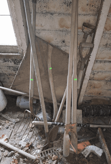 Long handle tools assortment inc. rake, pitch fork and post hole digger ...