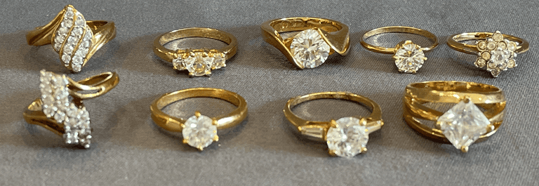9- Gold tone rings including diamond like stones, 10kge - Metzger ...