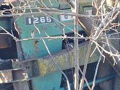 Oliver 1265 Gas Utility Tractor with loader (a chainsaw will be needed ...