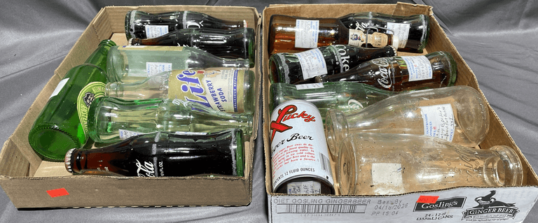 Unopened vintage Coca-Cola bottles, Bordens clear glass milk bottles ...