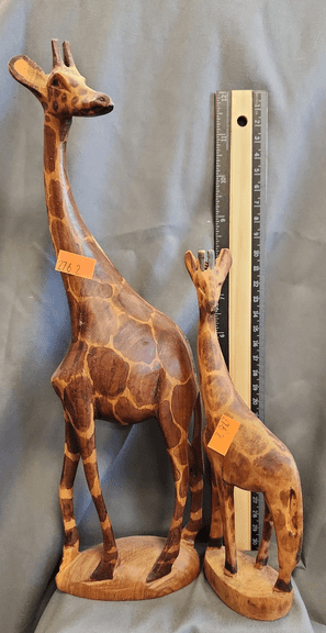 2- Carved Wood Giraffes - Metzger Property Services, LLC